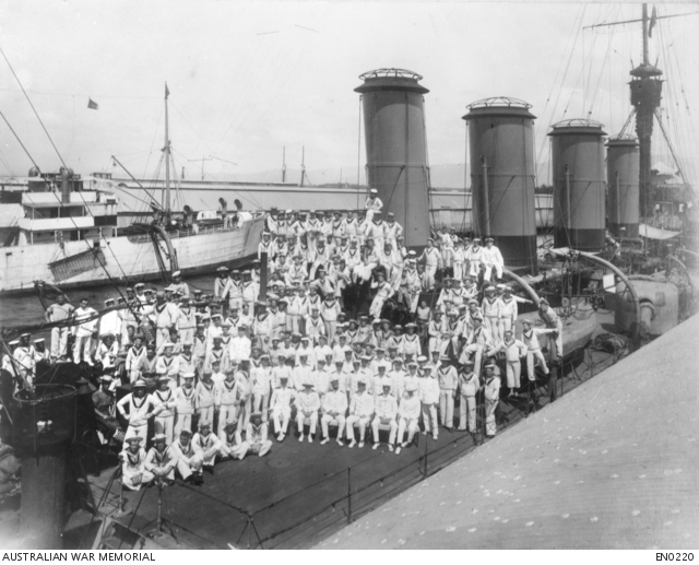 Group portrait of members of the crew aboard HMAS Melbourne. Along with ...
