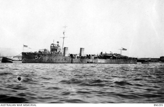 The destroyer HMAS Torrens anchored in the harbour of the Sicilian town ...