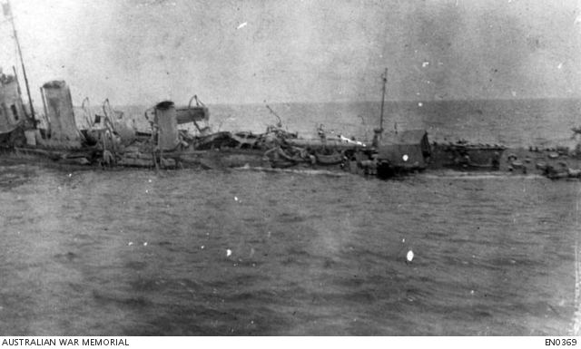 The destroyer HMS Phoenix listing badly after she was torpedoed. HMAS ...