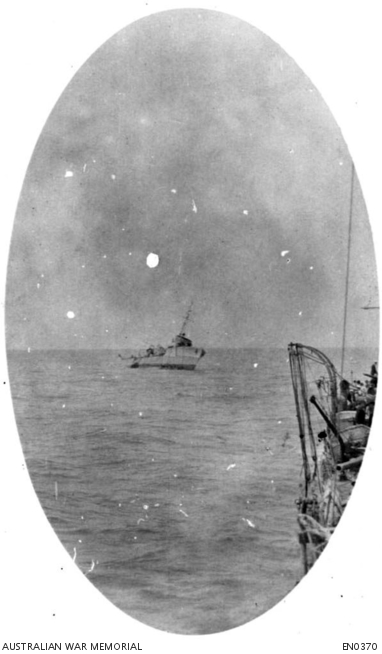 The destroyer HMS Phoenix lists to port after being torpedoed. In the ...