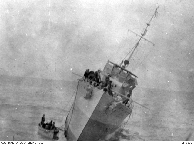 The destroyer HMS Phoenix lists badly to port just after being ...