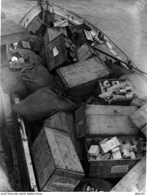A boatload of provisions taken from Direction Island by a party from ...