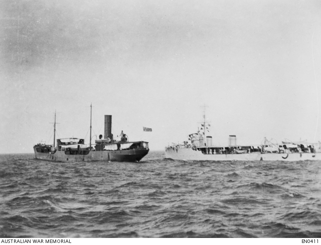The destroyer HMAS Swan (right) drawing alongside the SS Esturia. The ...