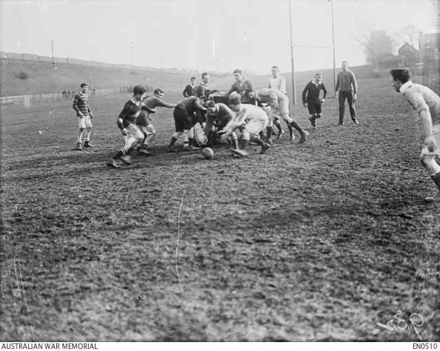 A ruck and maul during the rugby match between a team representing HMAS ...