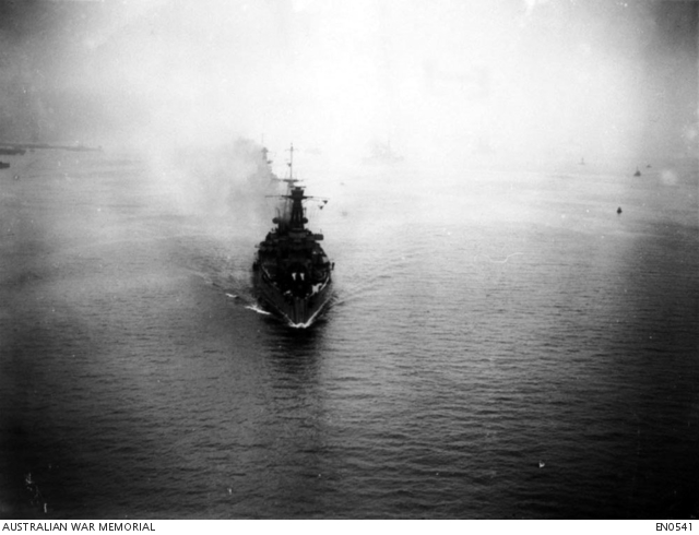 HMAS Australia passing under the Forth Bridge in Scotland, followed by ...