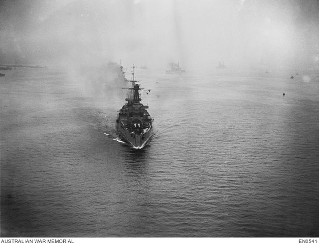 HMAS Australia passing under the Forth Bridge in Scotland, followed by ...