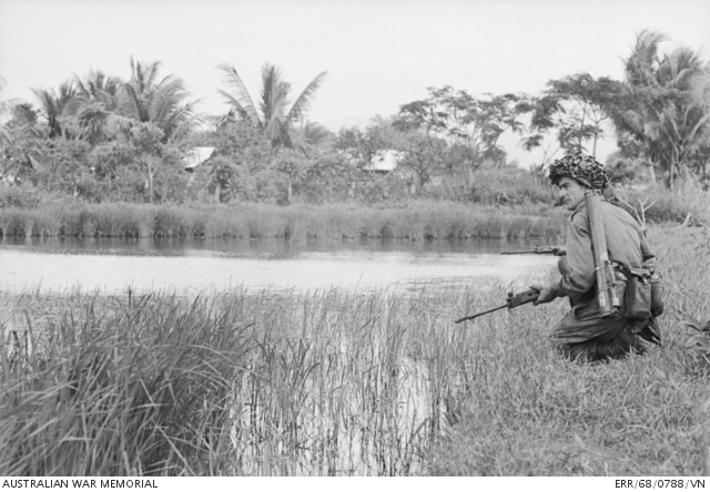 Long Dien, South Vietnam. 1968-08. A break in patrolling for Private David McKellar of Hobart ...