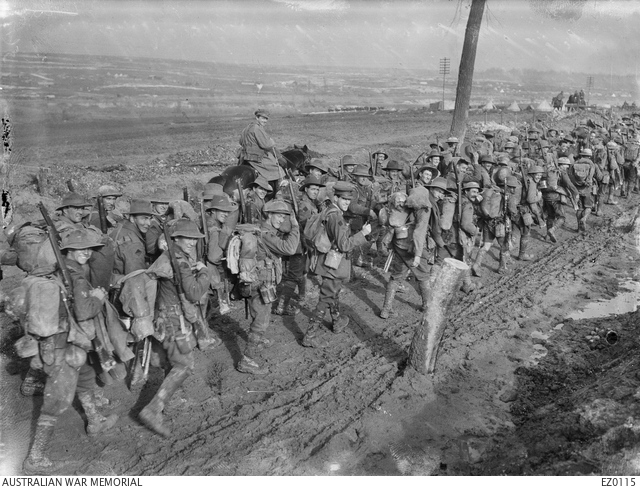 Unidentified members of the 2nd Australian Division marching along a ...