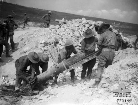 Five members of an Australian trench mortar battery preparing to fire ...