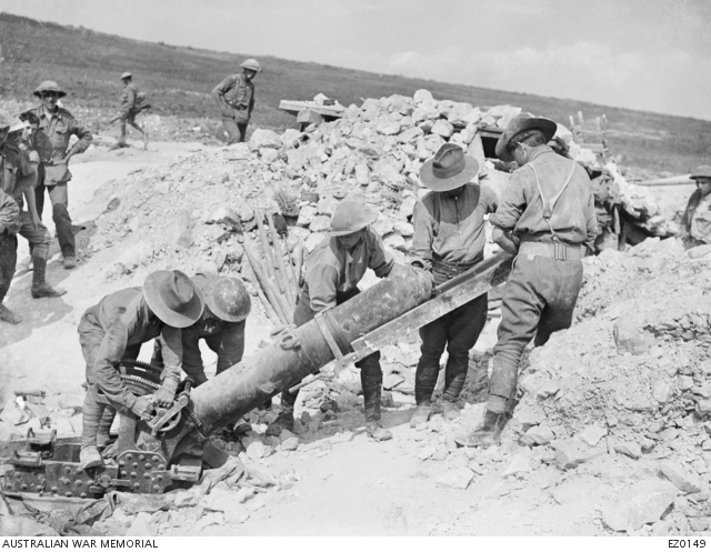 Five members of an Australian trench mortar battery preparing to fire ...