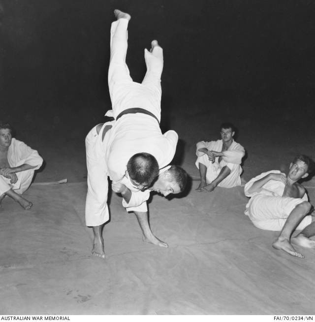 It is up and over for Korean judo instructor, Sergeant Lee Yong Gook ...