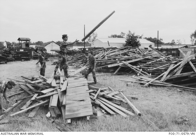 Saigon, South Vietnam. November 1971. Vietnamese soldiers stack timber ...