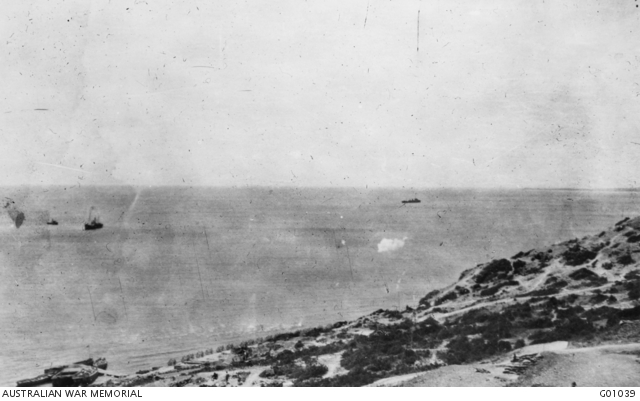 Gallipoli Peninsula, Turkey. July 1915. A shell bursting over the beach ...