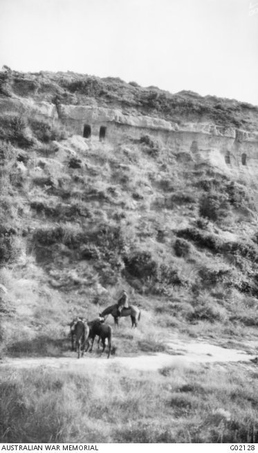 English dugouts which have been dug into the rock face on the side of ...