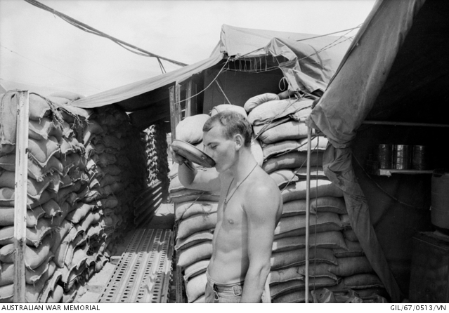 Vietnam. 1967-06. Signalman W. Paul Goldstone, bare-chested, is having ...