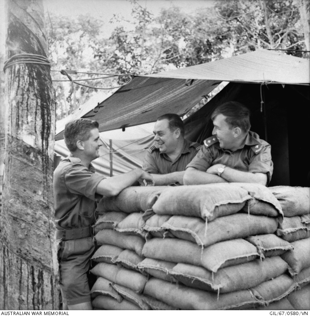 Vietnam. 1967-08. While using sand bags to lean on, Flight Lieutenant ...
