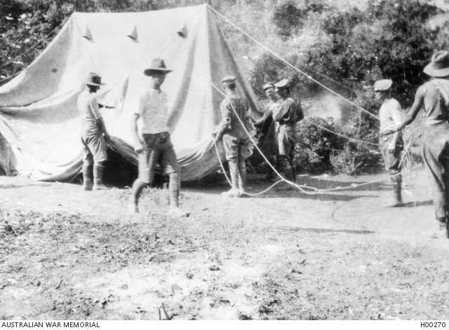 Unidentified soldiers erecting a marquee to be used as an operating ...