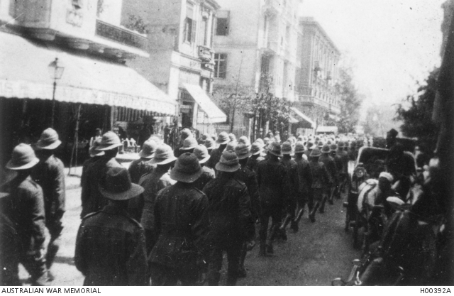 A group of Australian soldiers taking part in a march through the town ...