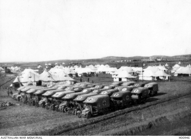 Motor ambulances drawn up in front of the tented accommodation of the ...