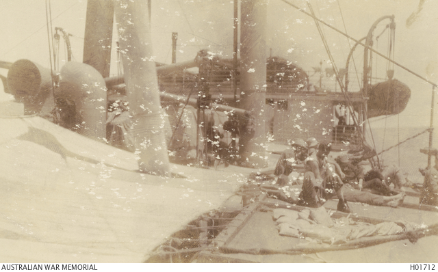 Troops sunbaking on HMAT Takada. | Australian War Memorial