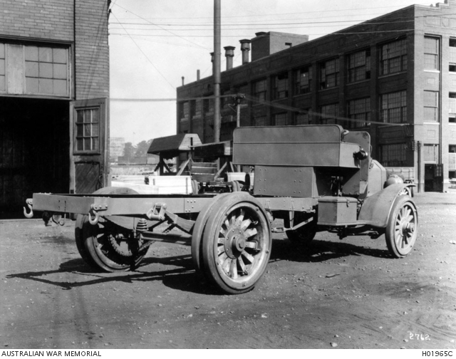 THREE-QUARTER REAR VIEW OF THE CHASSIS OF A PEERLESS TRUCK MADE IN ...