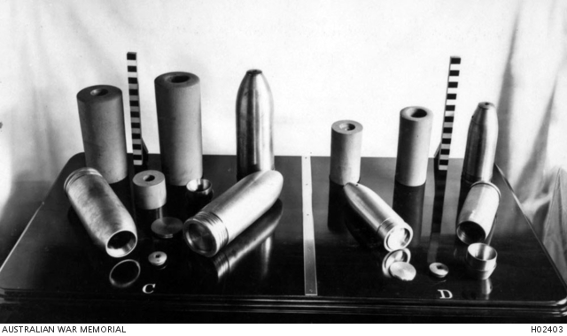 A DISPLAY OF TWO ARTILLERY SHELLS BROKEN DOWN TO COMPONENTS. LOCATION ...