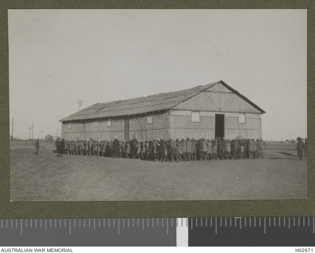Ludd, Palestine. c. 1918. Members of the Egyptian Labour Corps carrying ...