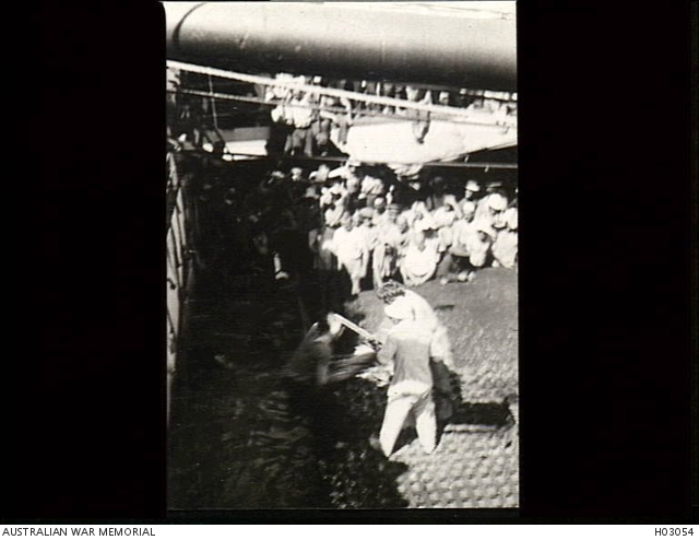 At Sea. c. 1915. Australian servicemen at a crossing the line ceremony ...