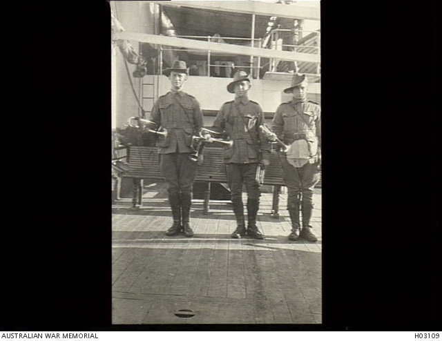 At Sea. c. 1915. Three trumpeters on the deck of a troopship. These ...