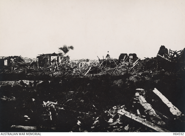 Shell bursting in Lens. | Australian War Memorial