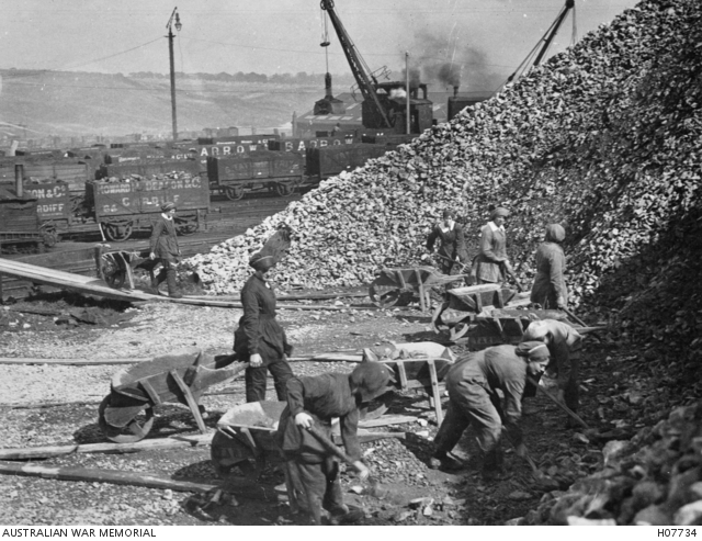 England. Women war workers loading wheelbarrows from a limestone ...