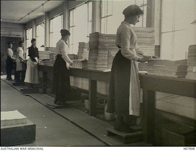 Scotland. Women war workers examining paper from the paper mill in ...