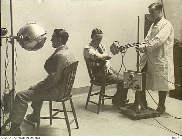 London, England. Two soldiers undergoing ultra violet ray treatment at the 4th British Army ...