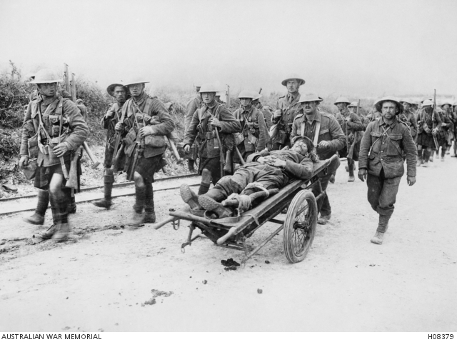 Western Front. c. 1916. Scottish Highlanders on the move with a wounded ...