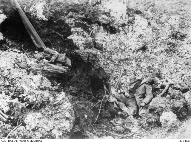 The bodies of two dead soldiers in a shell hole in the centre of the ...