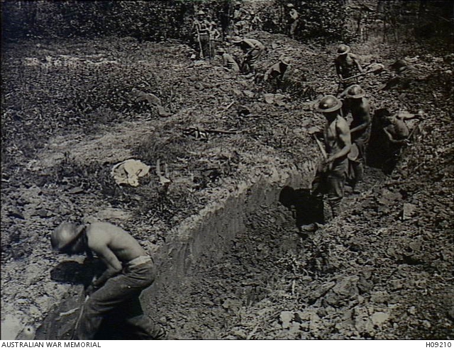 Messines, Belgium. c. 1917. A communication trench being dug by British ...