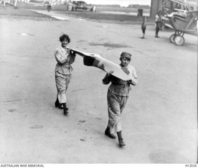 "A SPARE PART" (BRITISH AIR MINISTRY PHOTO PPG288) [TWO WOMEN CARRYING ...