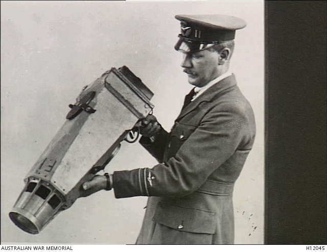 A Royal Air Force (RAF) officer inspecting a captured German aerial ...