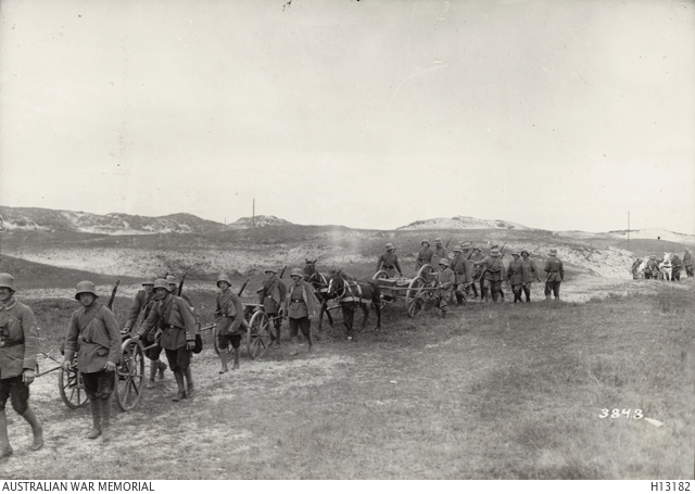 German Marine Corps personnel bringing guns, some human drawn and some ...