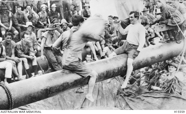 At Sea. A greasy pole pillow fight contest in progress aboard troopship ...