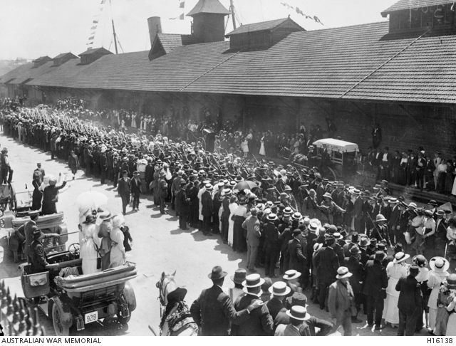 The scene at the wharf as relations and friends greet the first return ...