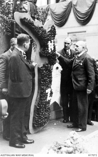 Major General Sir Andrew Russell and a one armed soldier placing a ...