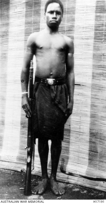 New Britain. c. 1915. A native police boy armed with a rifle. (Donor A ...