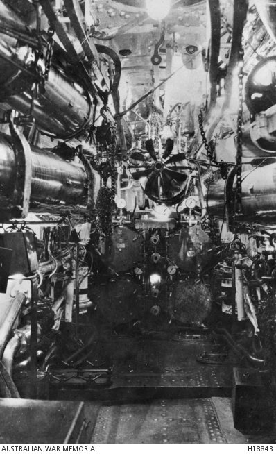 The interior of a submarine showing a group of torpedo tubes. The ...