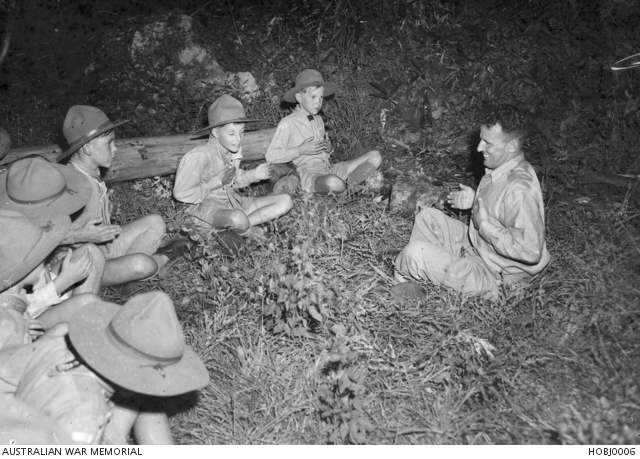 Informal portrait of unidentified boy scouts and the scoutmaster of the ...
