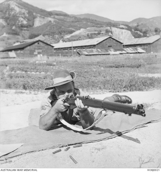 Unidentified Australian army Warrant Officer Class 2 (WO2) taking aim ...