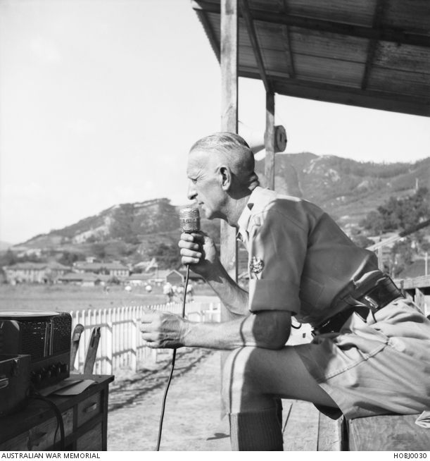 345096 Warrant Officer Class 1 (WO1) H T 'Jack' Harwood using a ...