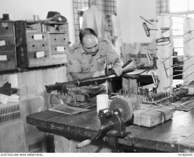 Unidentified Australian army Warrant Officer Class 2 (WO2) working on a ...