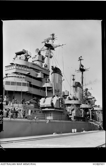 USS Helena (CA-75), a Baltimore Class Heavy Cruiser docked in Kure ...
