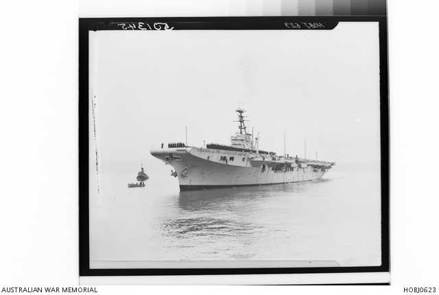 HMS Triumph, a Colossus Class Light Fleet aircraft carrier, closing in ...